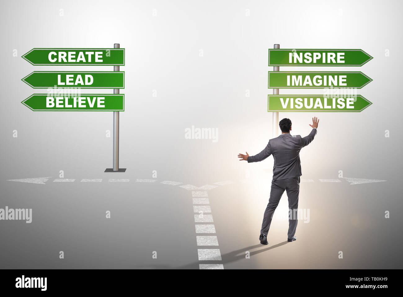 Businessman having hard choice standing at crossroads Stock Photo - Alamy