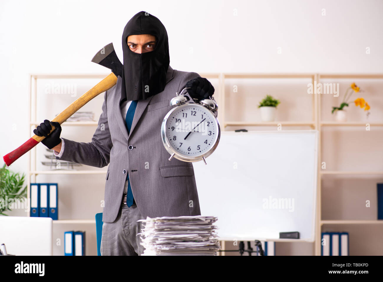 Male gangster stealing information from the office Stock Photo - Alamy