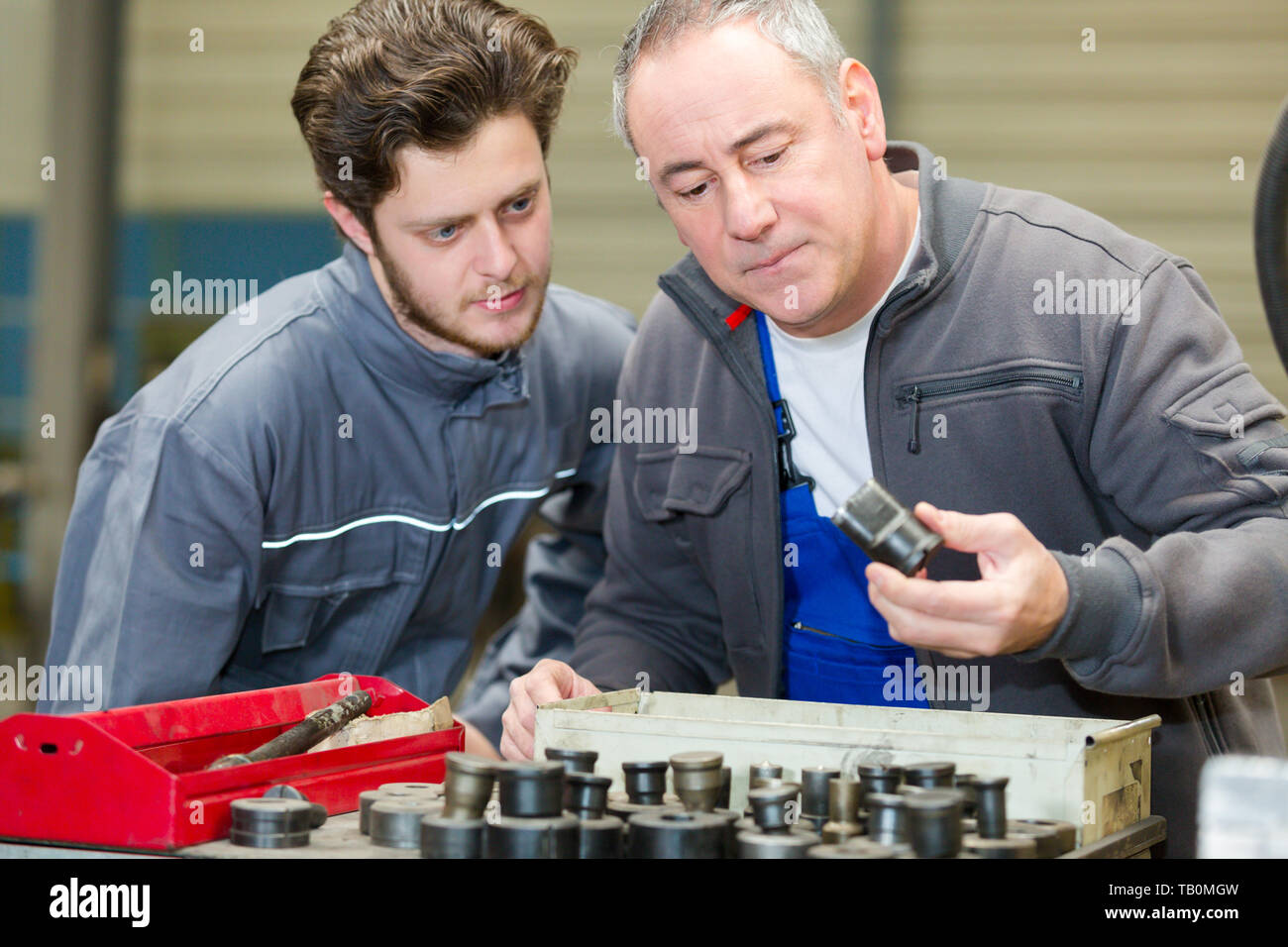 engineer looking for the correct sized tool Stock Photo - Alamy
