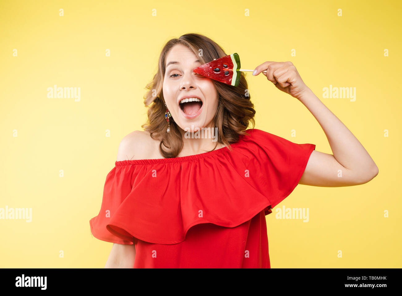 Beautiful and seductive woman wearing like sweet doll, posing at studio ...