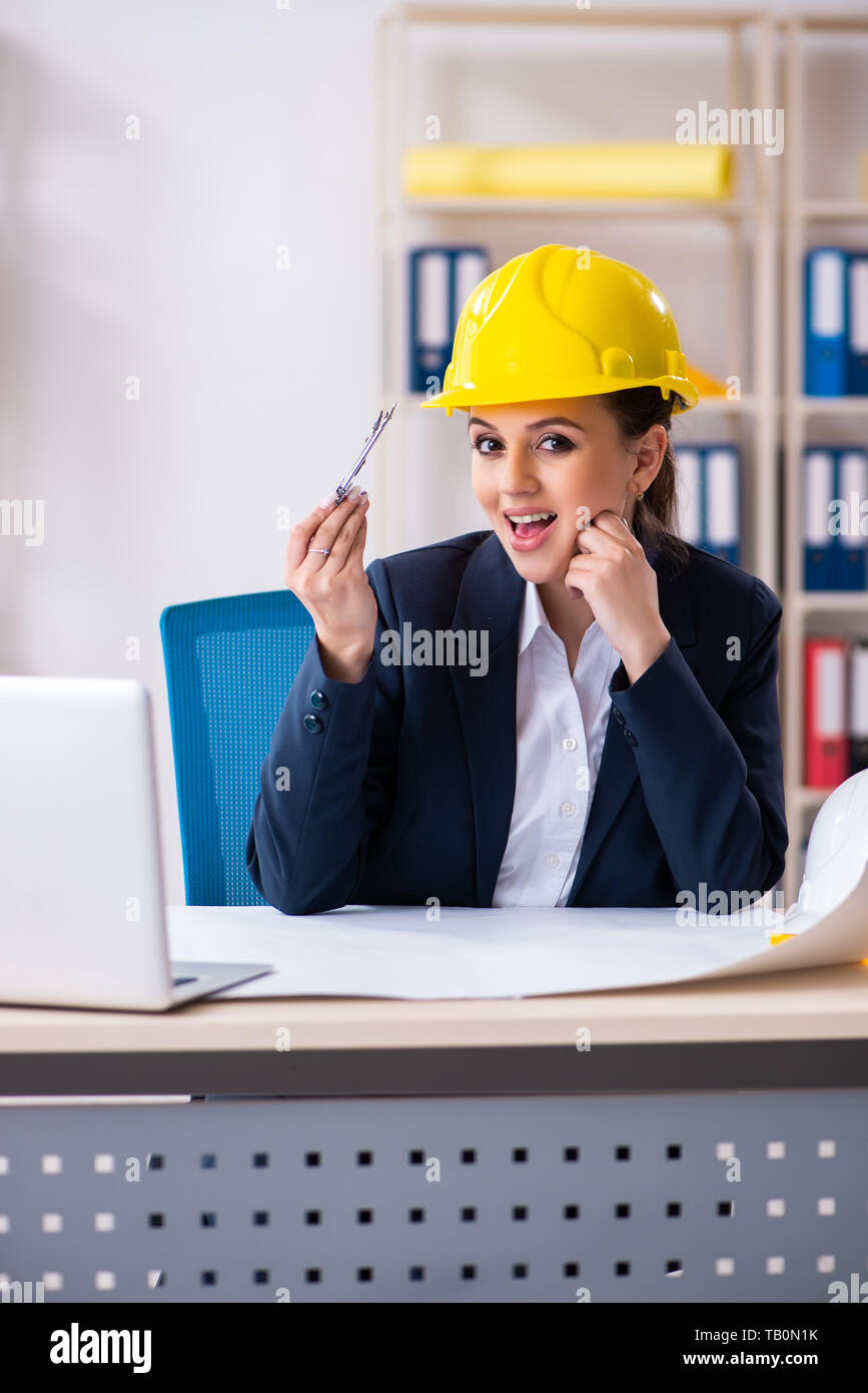 Young female architect working in the office Stock Photo - Alamy