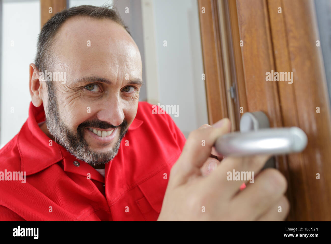 locksmith have to fix silver knob Stock Photo - Alamy