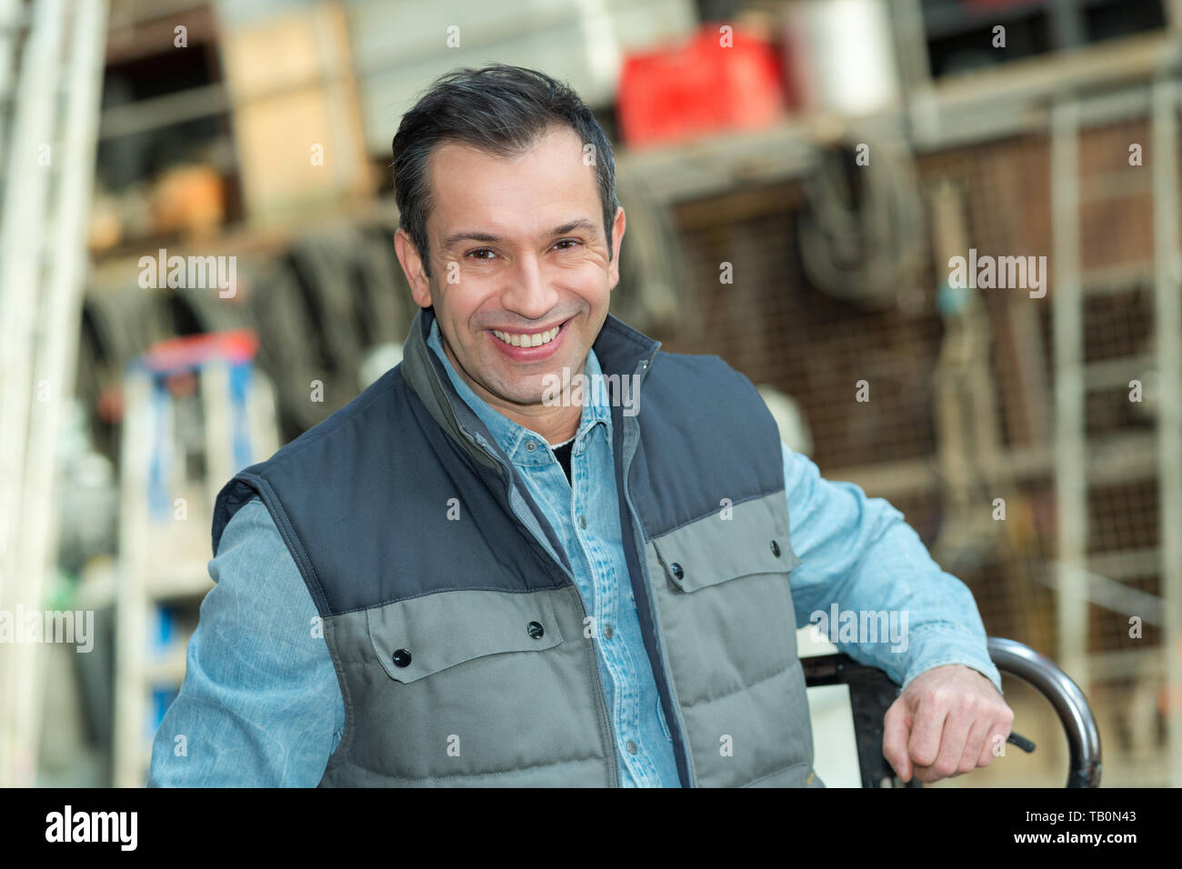 male factory worker smiling Stock Photo - Alamy