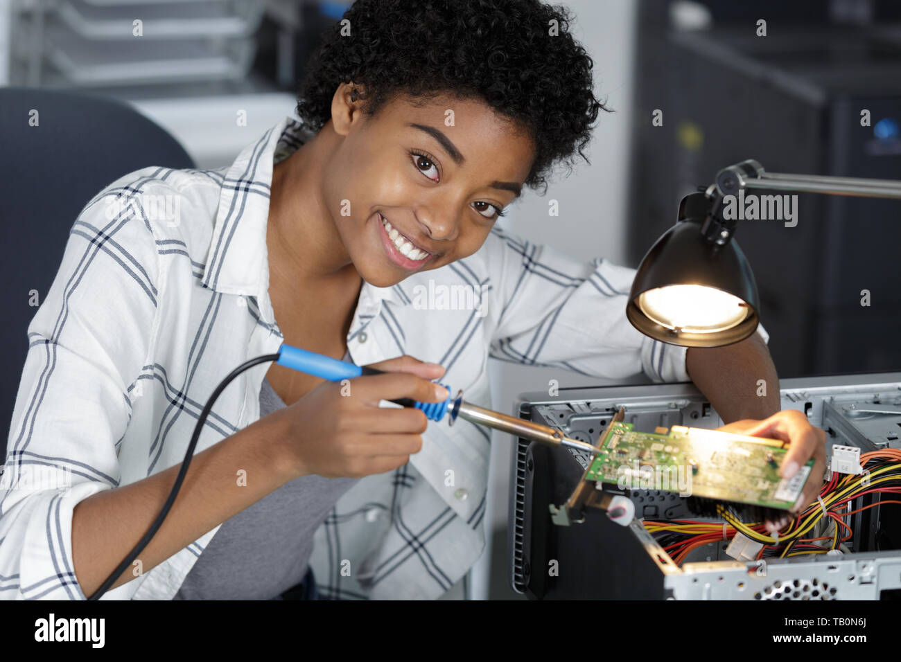 Woman soldering elements circuit hi-res stock photography and images ...