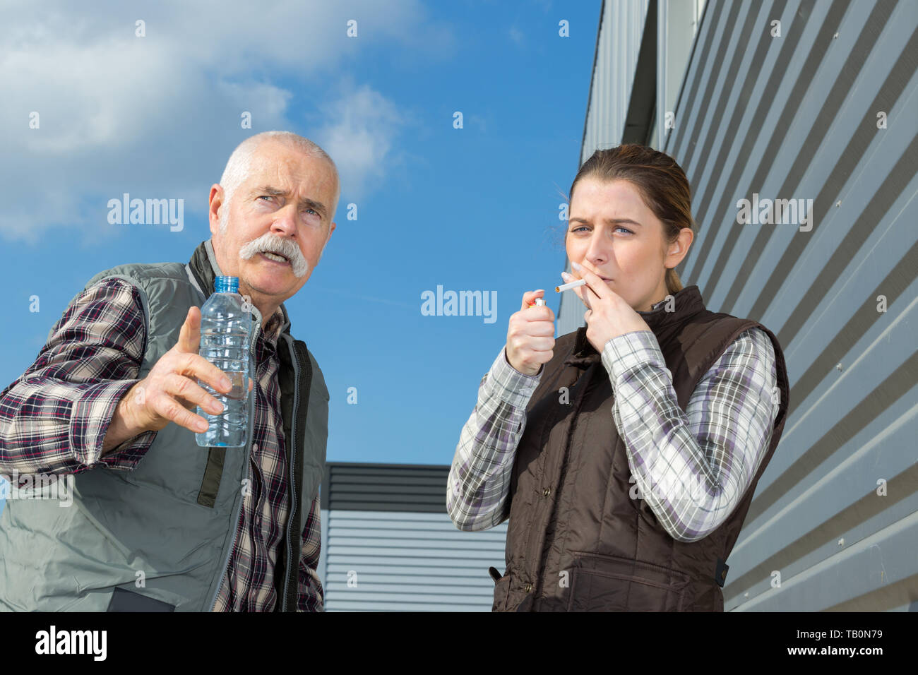Smoking cigarette break office woman hi-res stock photography and ...