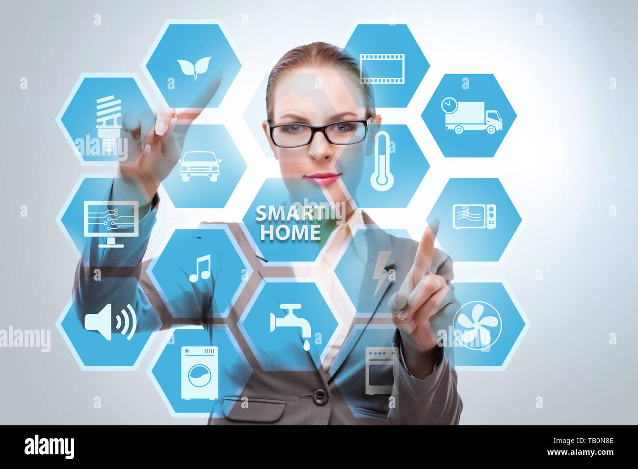 Smart home concept with woman Stock Photo - Alamy