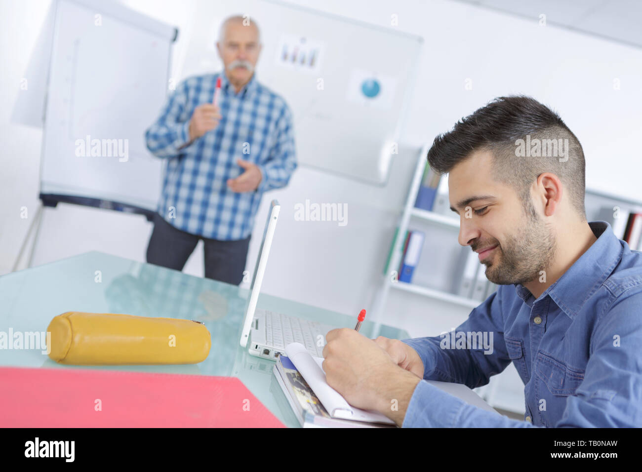 Educator teaching young student hi-res stock photography and images - Alamy
