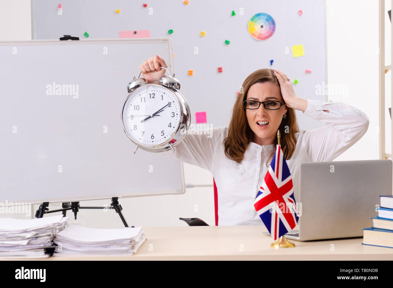 Female english language teacher in time management concept Stock Photo ...