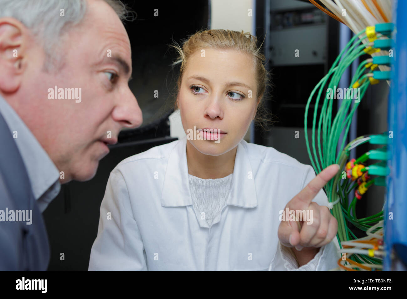 engineer woman in network server room Stock Photo - Alamy