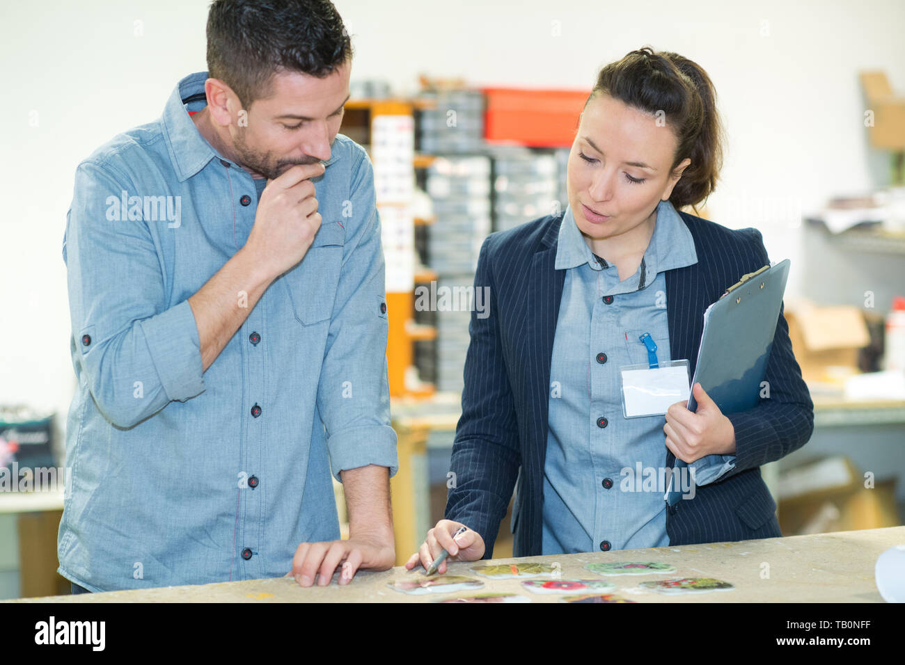workers looking at design samples Stock Photo - Alamy