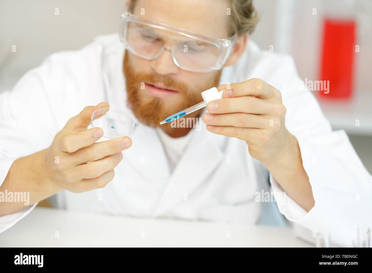 man working with tubes in lab Stock Photo - Alamy