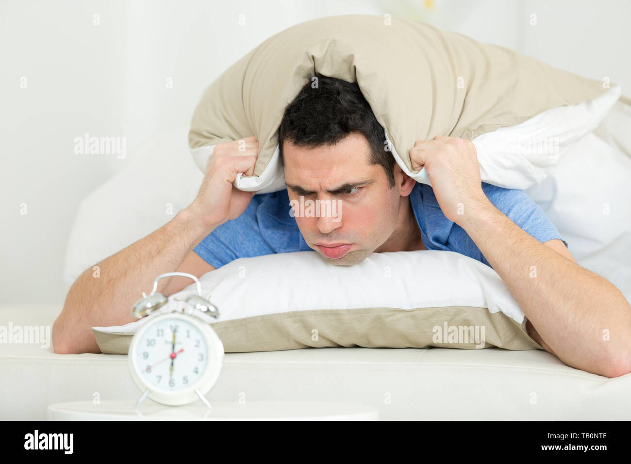 Man pillow over head hi-res stock photography and images - Alamy