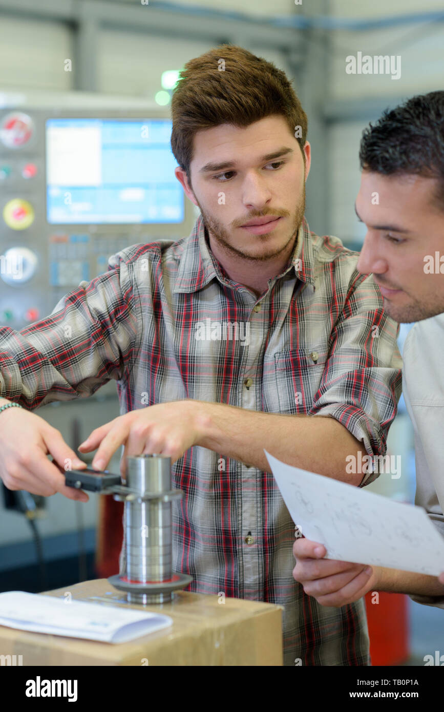 man as apprentice works in teamwork together Stock Photo - Alamy