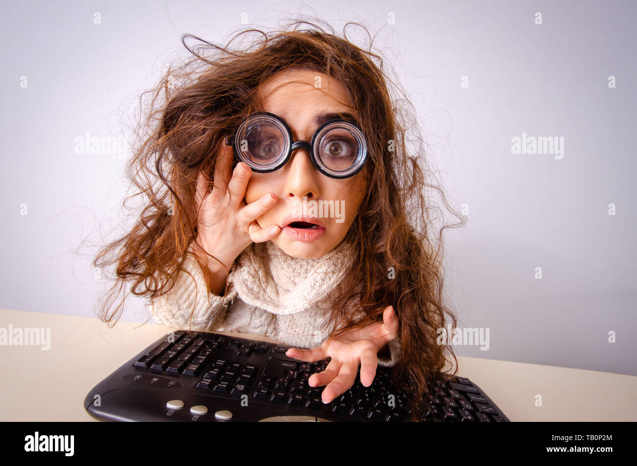 Funny nerd girl working on computer Stock Photo - Alamy