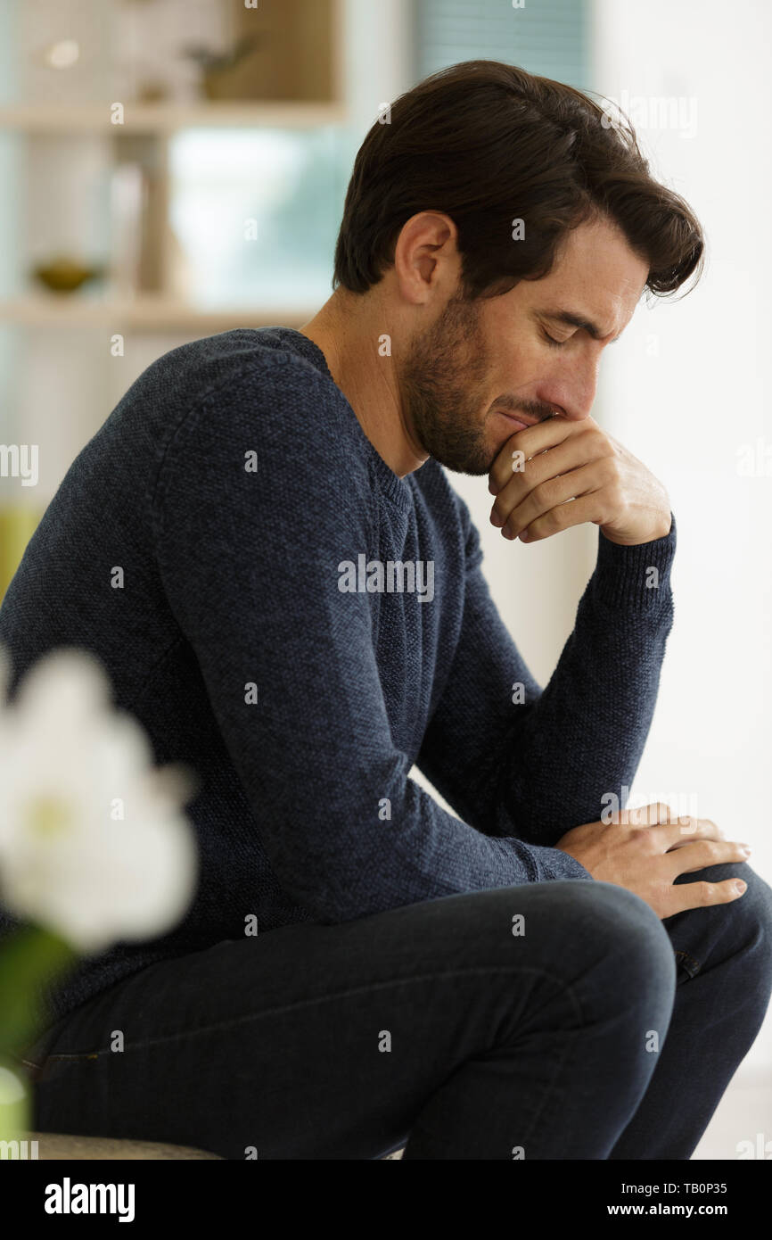 sad man crying at home Stock Photo - Alamy