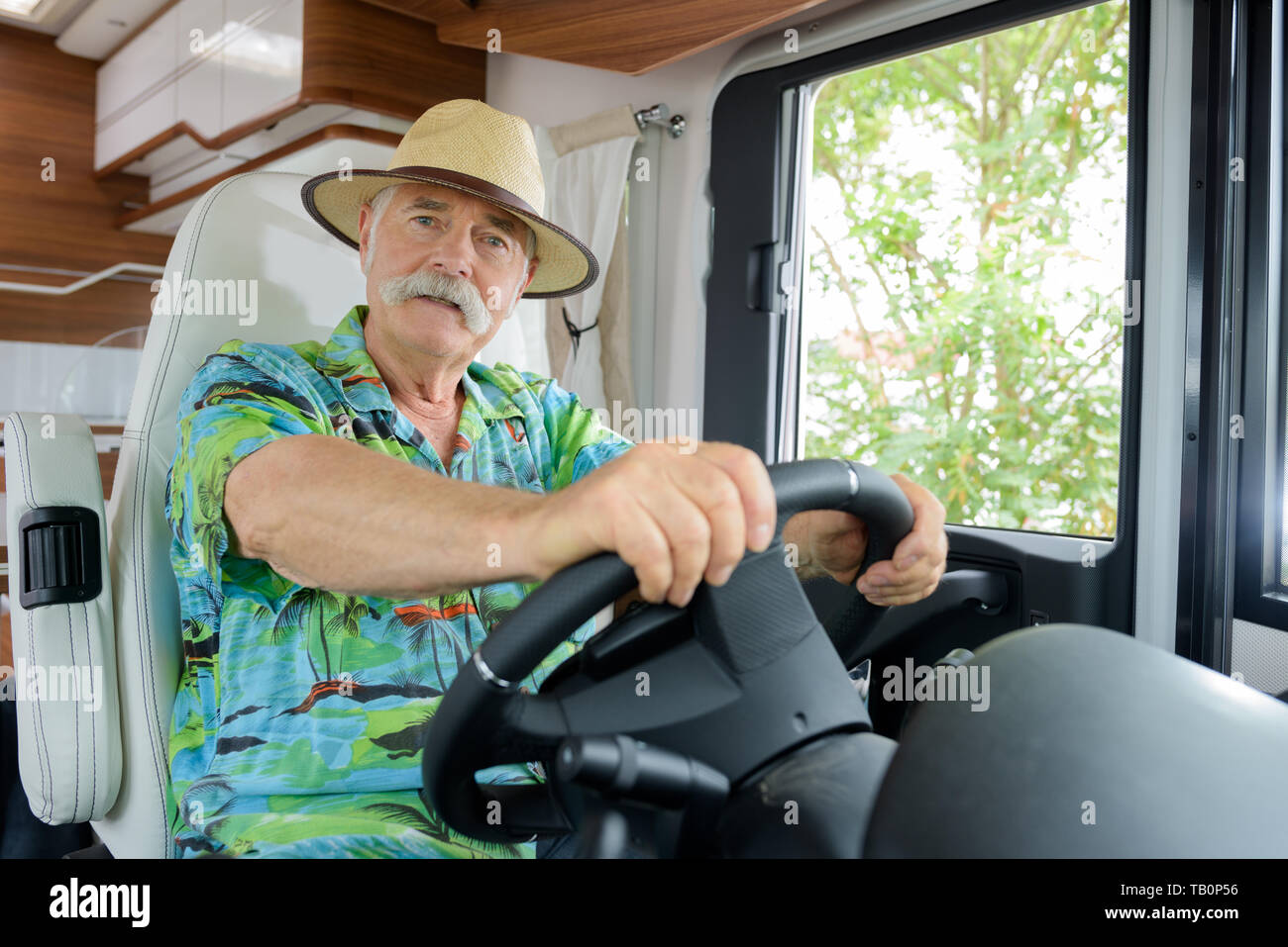 senior man riding a camper van Stock Photo - Alamy