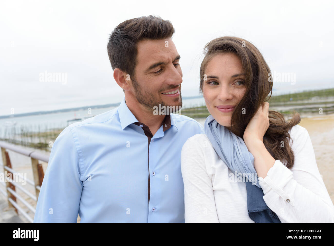couple breathing fresh air at the beach Stock Photo - Alamy