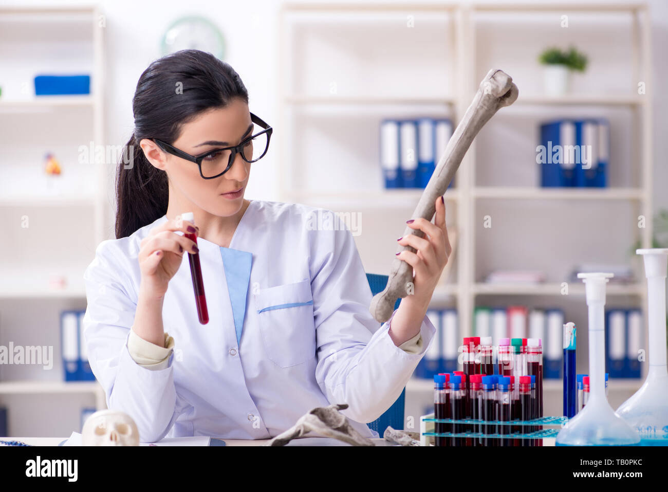 Young female archaeologist working in the lab Stock Photo - Alamy