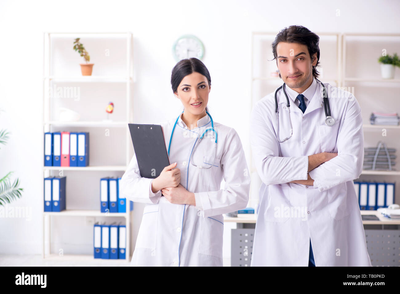 Two young doctors working in the clinic Stock Photo - Alamy
