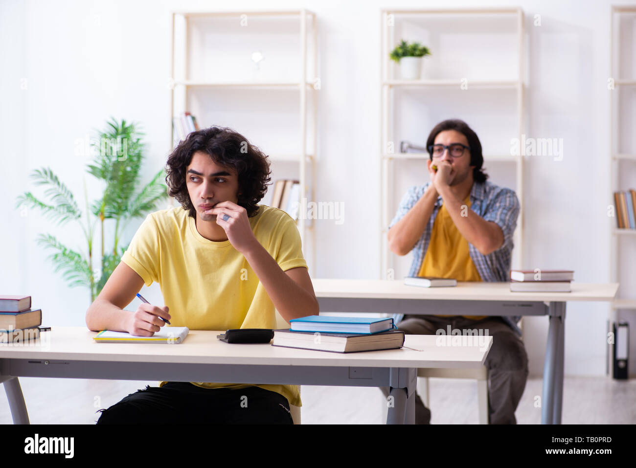 Two male students in the classroom Stock Photo - Alamy