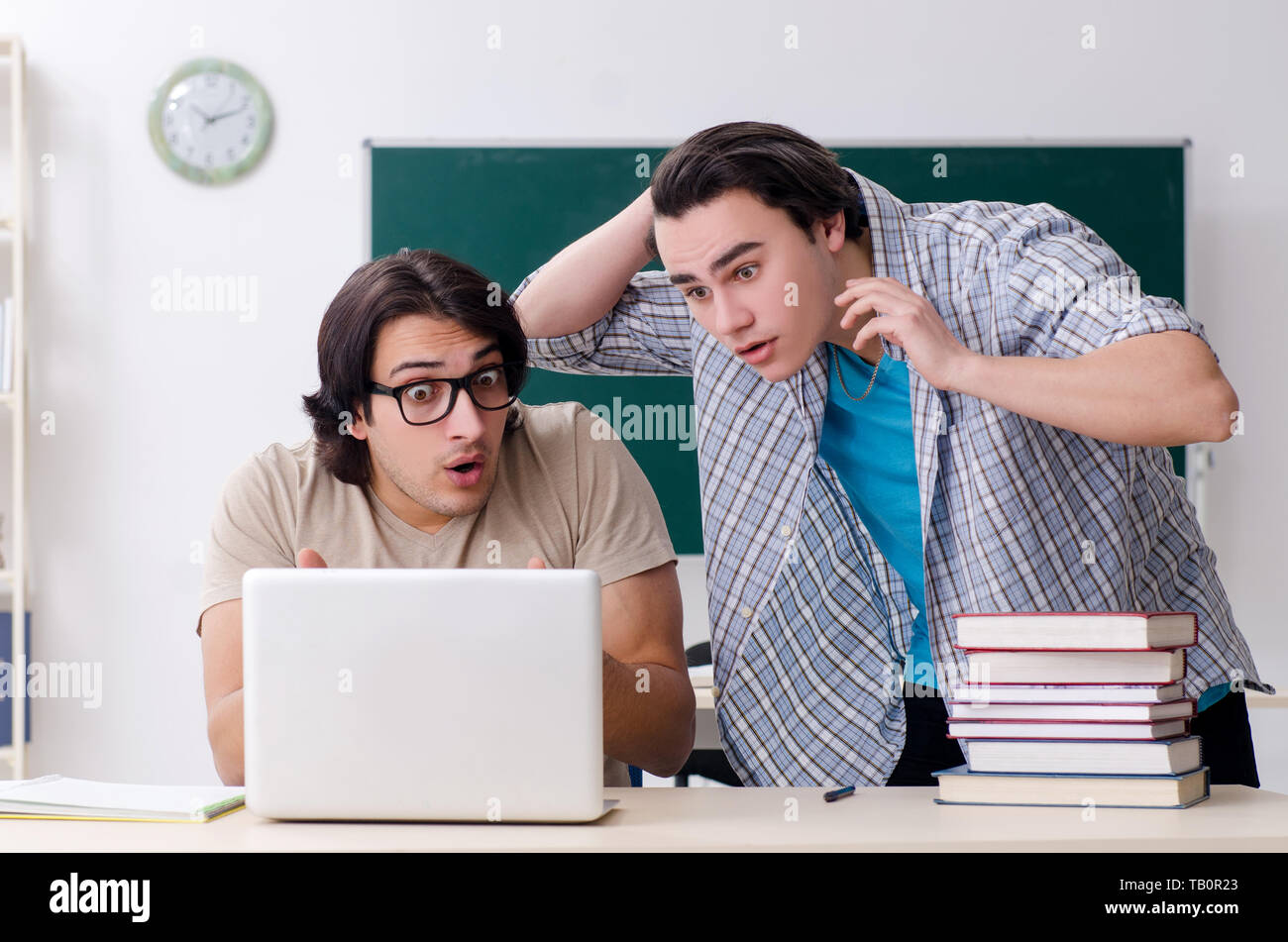 Two male students in the classroom Stock Photo - Alamy