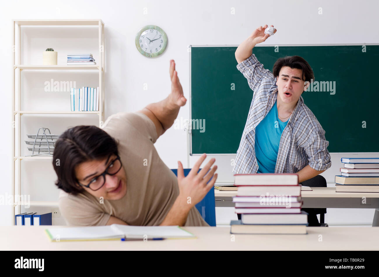 Throwing book classroom hi-res stock photography and images - Alamy