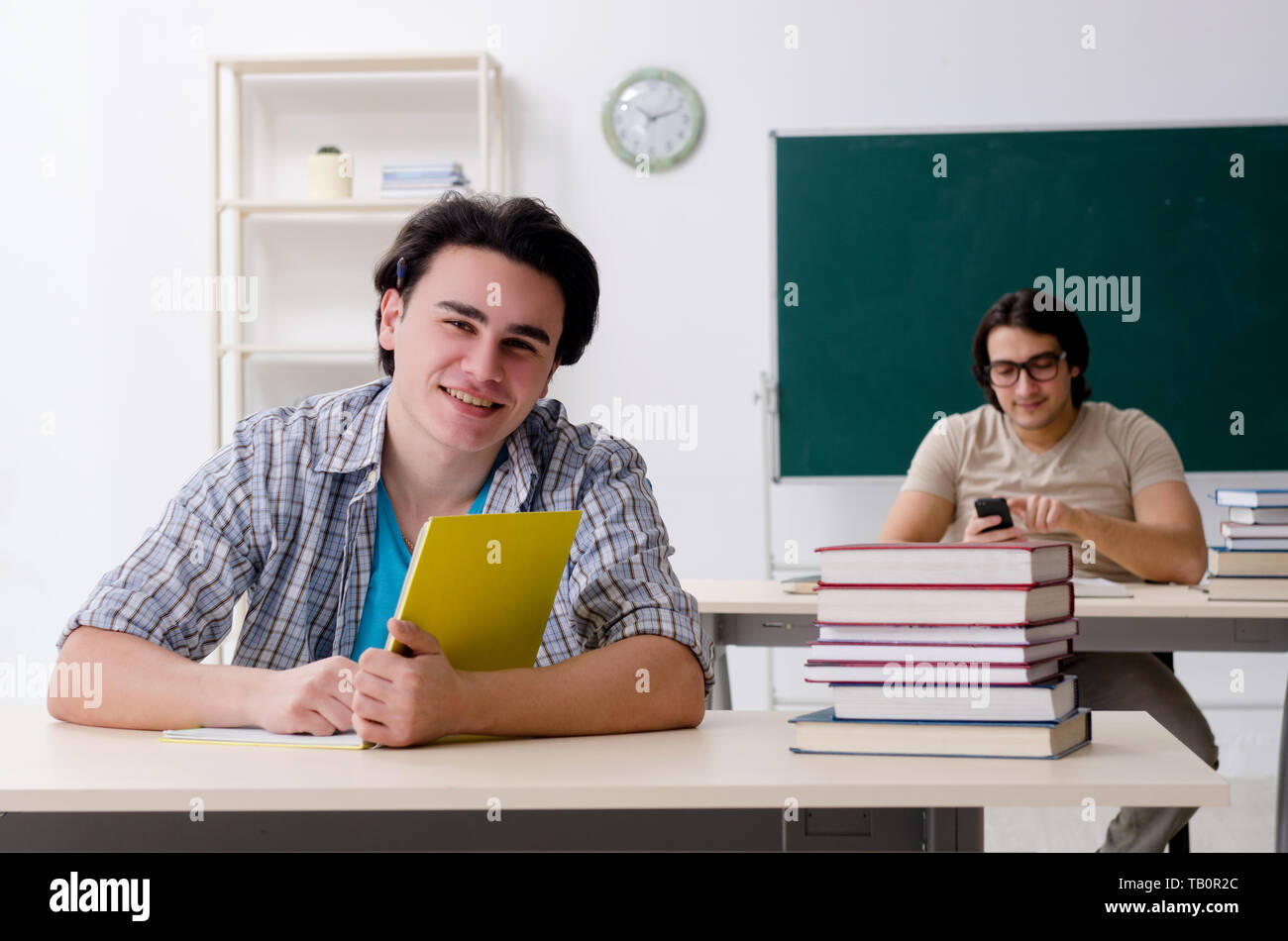 Two male students in the classroom Stock Photo - Alamy