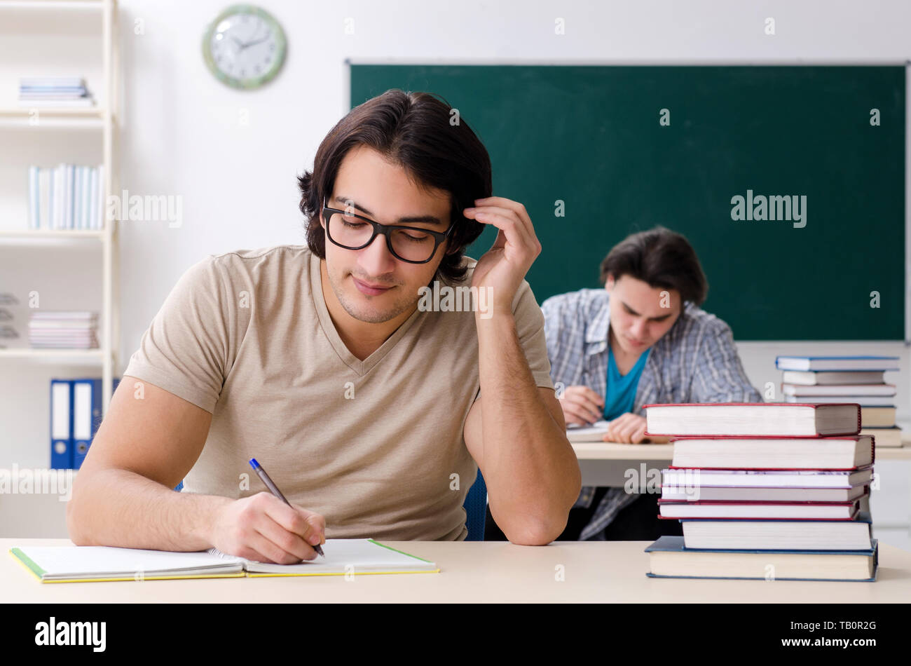 Two male students in the classroom Stock Photo - Alamy