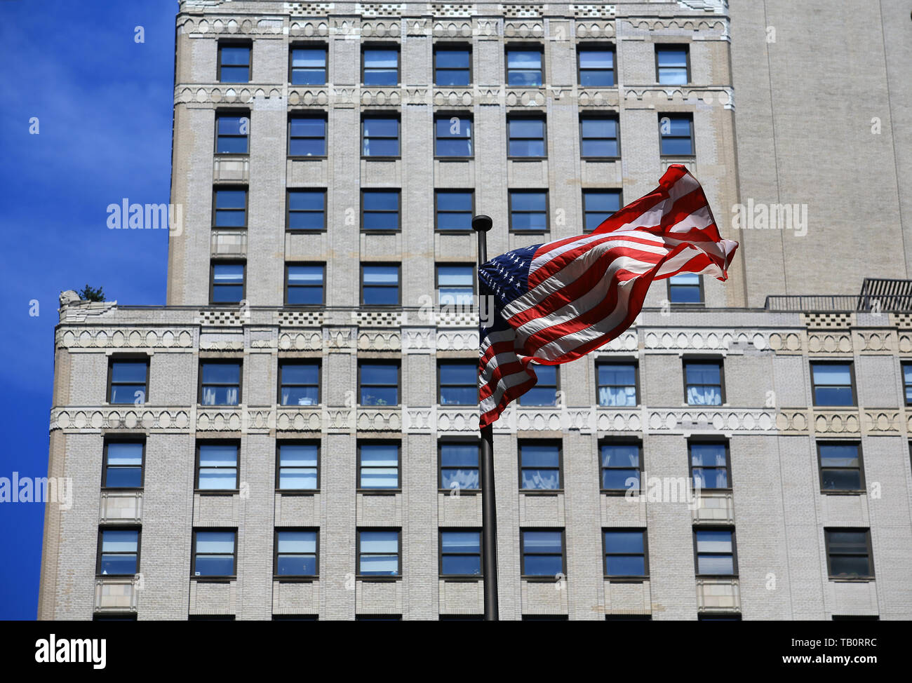 American flags waving in front hi-res stock photography and images - Alamy