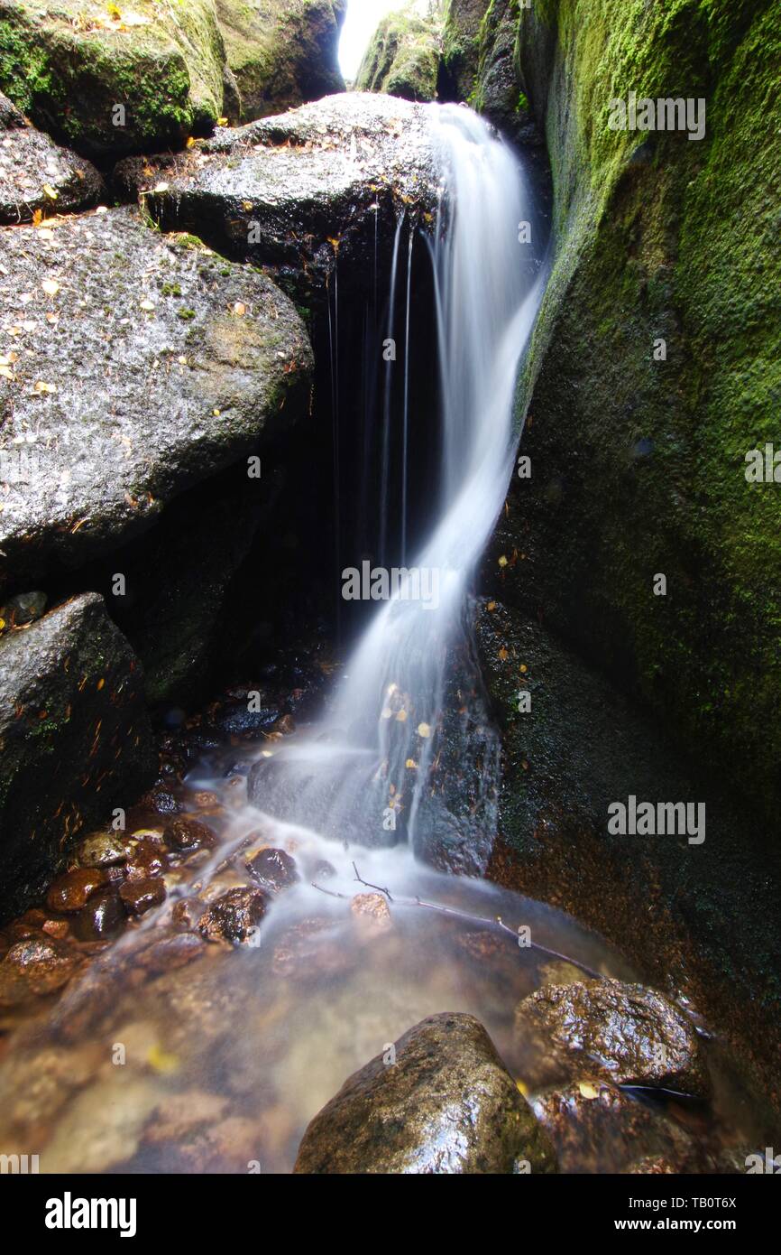 Waterfall at the Burn O'Vat Glacial Pothole on an Autumn Day. Muir of ...