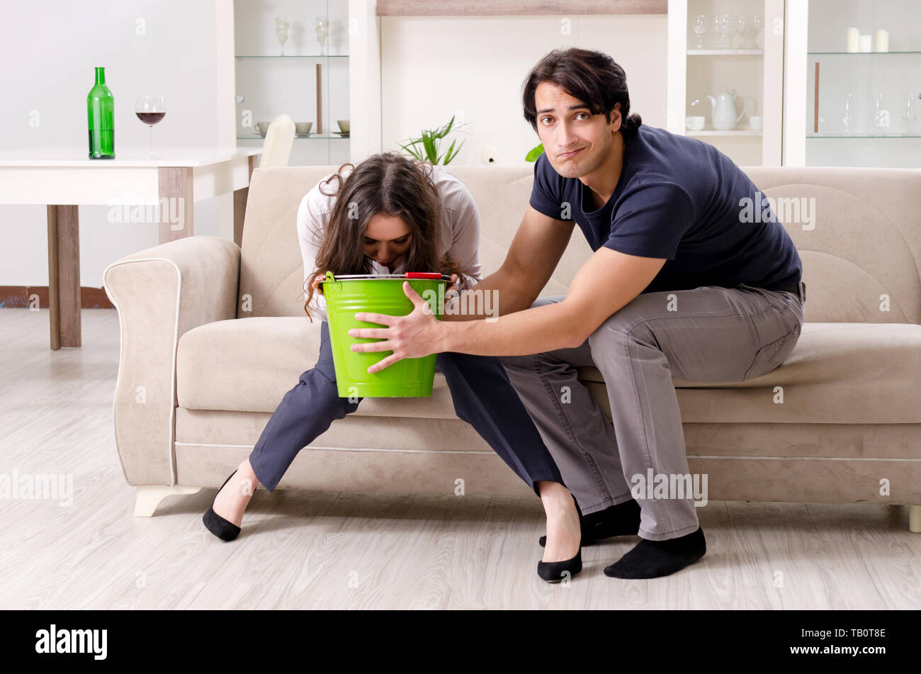 Young wife suffering from sick stomach and vomiting Stock Photo - Alamy