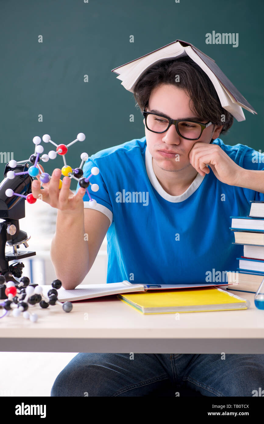 Young male student in the classroom Stock Photo - Alamy