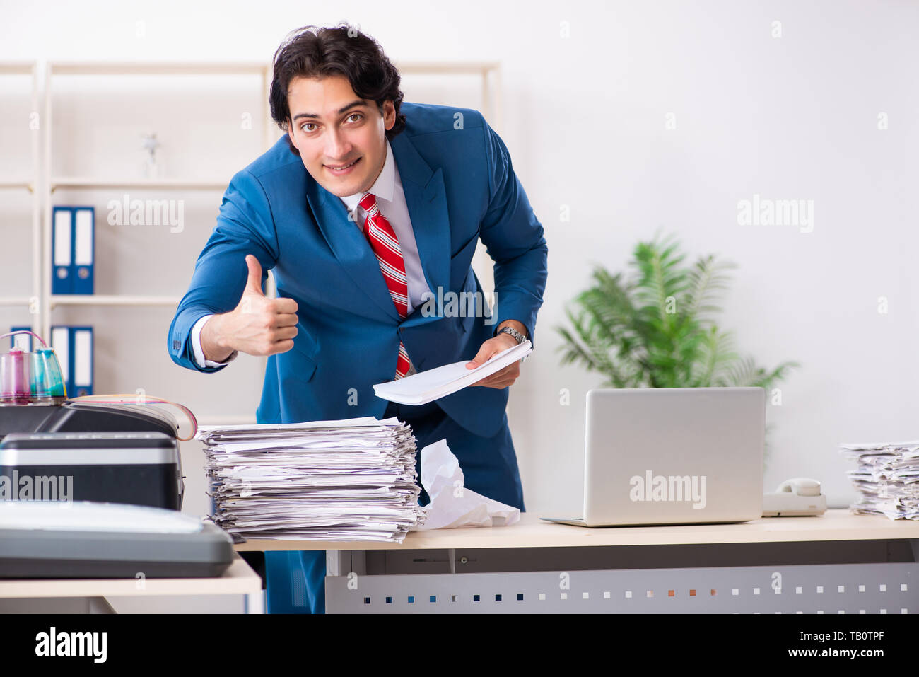Businessman making thumbs up working hi-res stock photography and ...