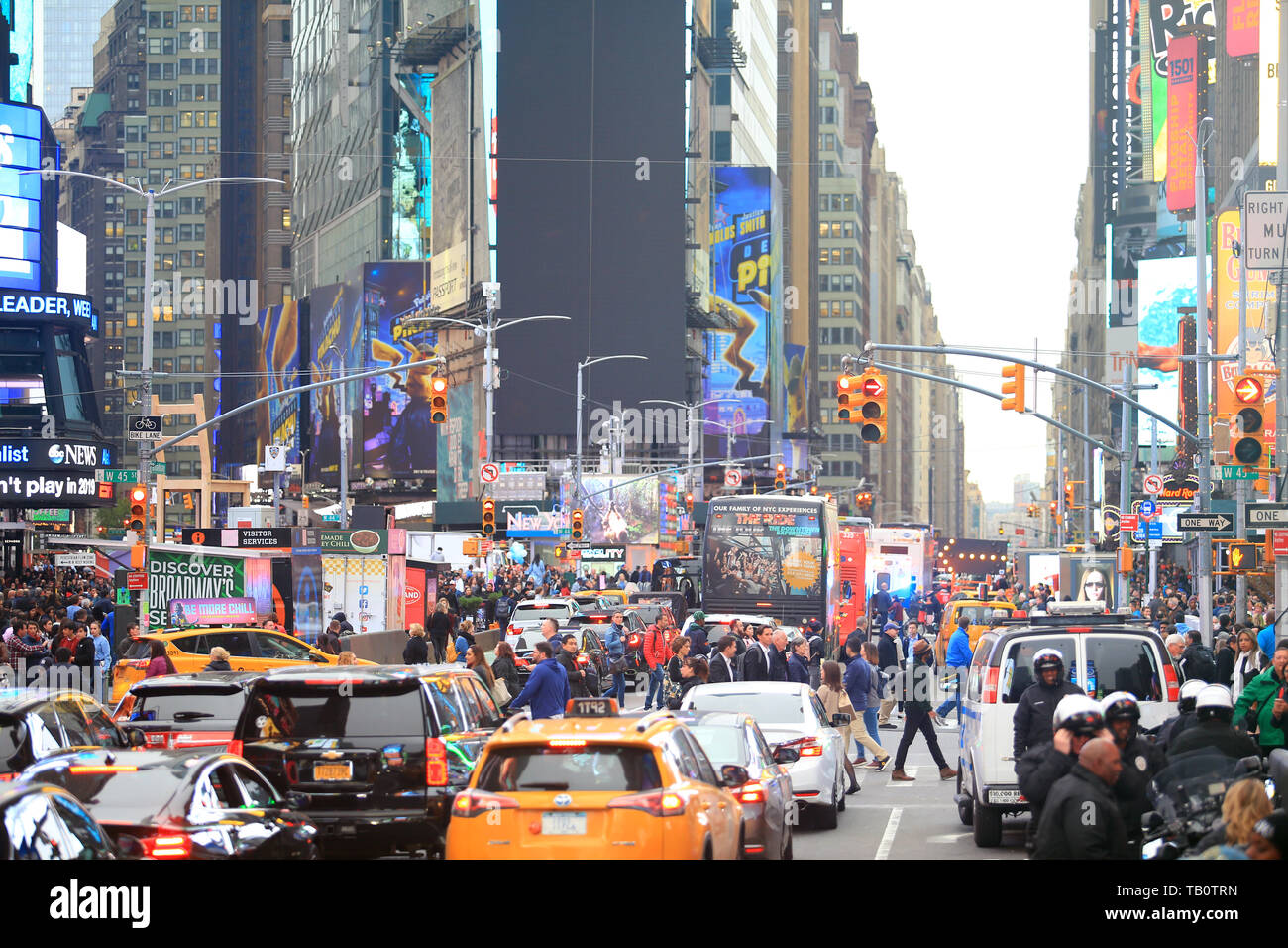 crowded tourists stay in times square. Times Square is a commercial ...