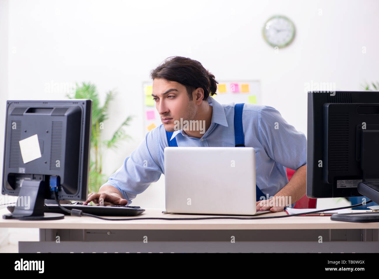 Male it specialist working in the office Stock Photo - Alamy