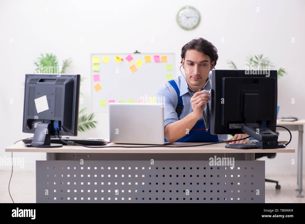 Male it specialist working in the office Stock Photo - Alamy