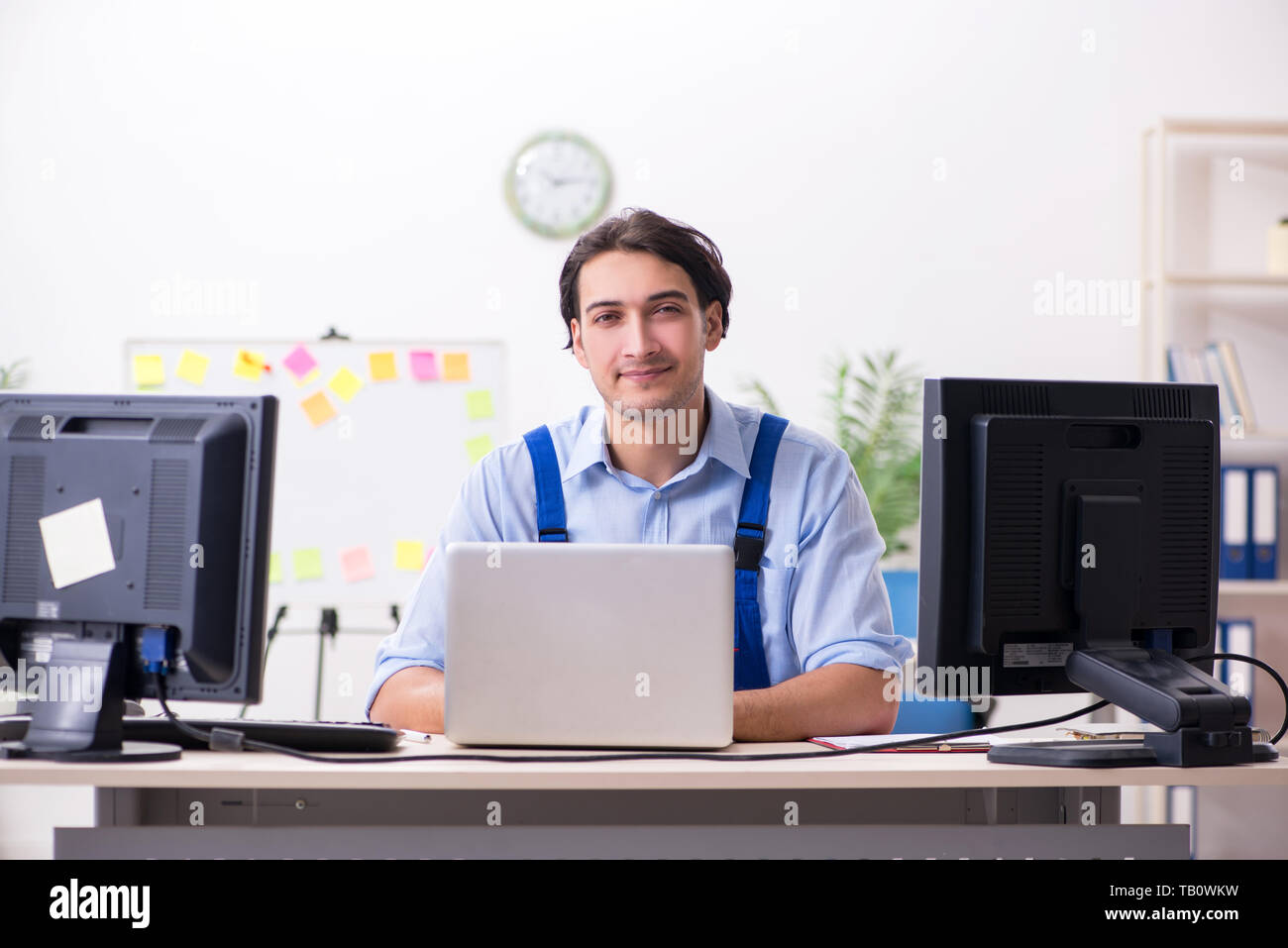 Male it specialist working in the office Stock Photo - Alamy