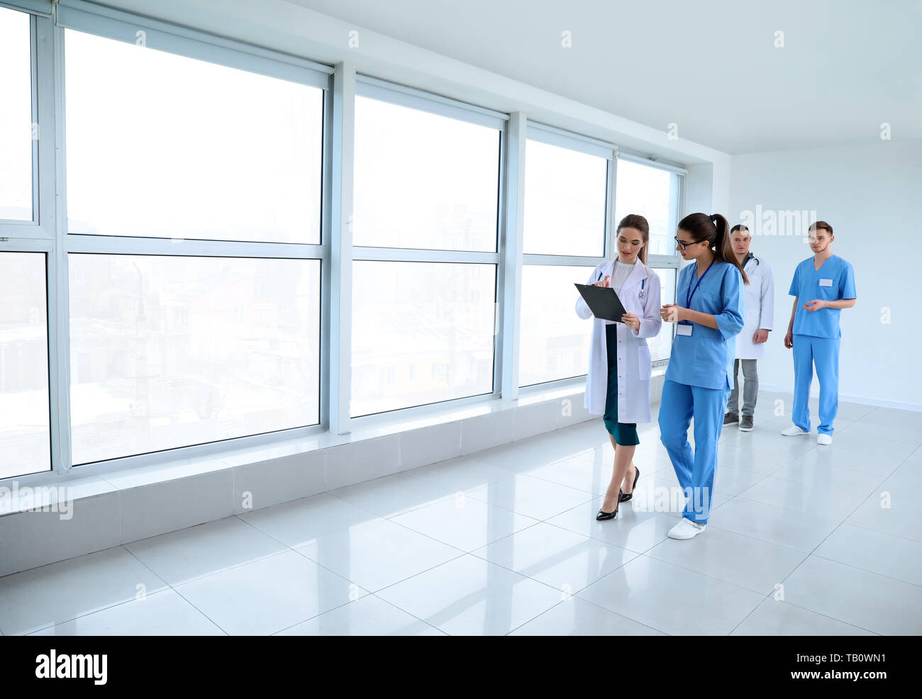 Man walking down hospital corridor hi-res stock photography and images ...