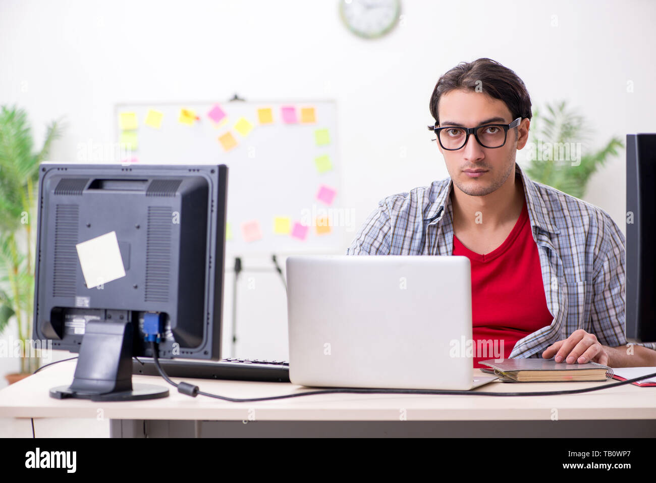 Male it specialist working in the office Stock Photo - Alamy
