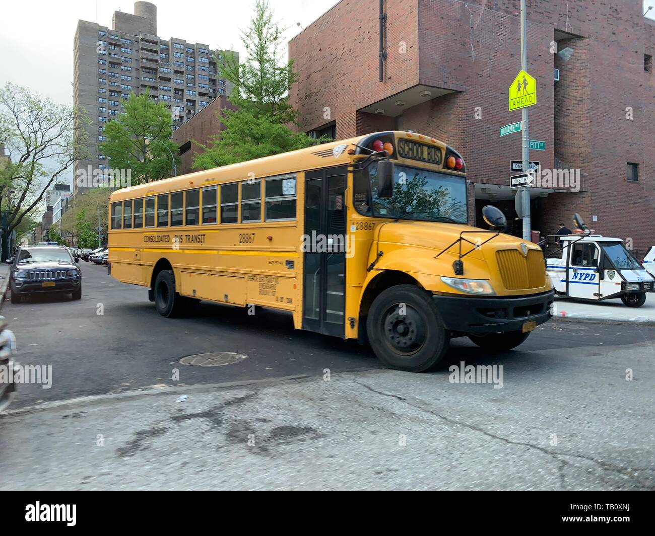 school bus cross the road in Lower East Side Stock Photo - Alamy