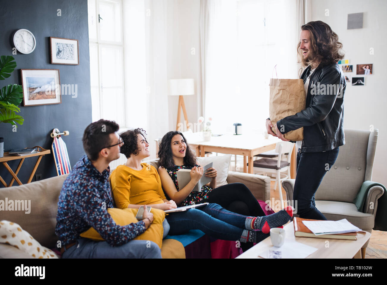 A group of young friends indoors at home, house sharing concept Stock ...