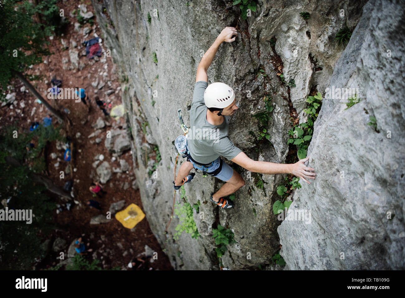Strong man climbing outside on a mountain Stock Photo - Alamy