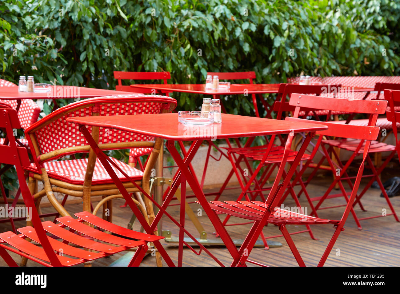 Outdoor restaurant red tables and chairs in summer Stock Photo - Alamy