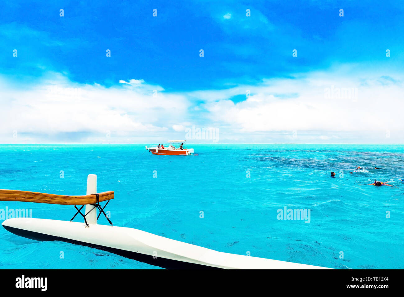 View of the red boat in the open ocean, Bora Bora, French Polynesia ...