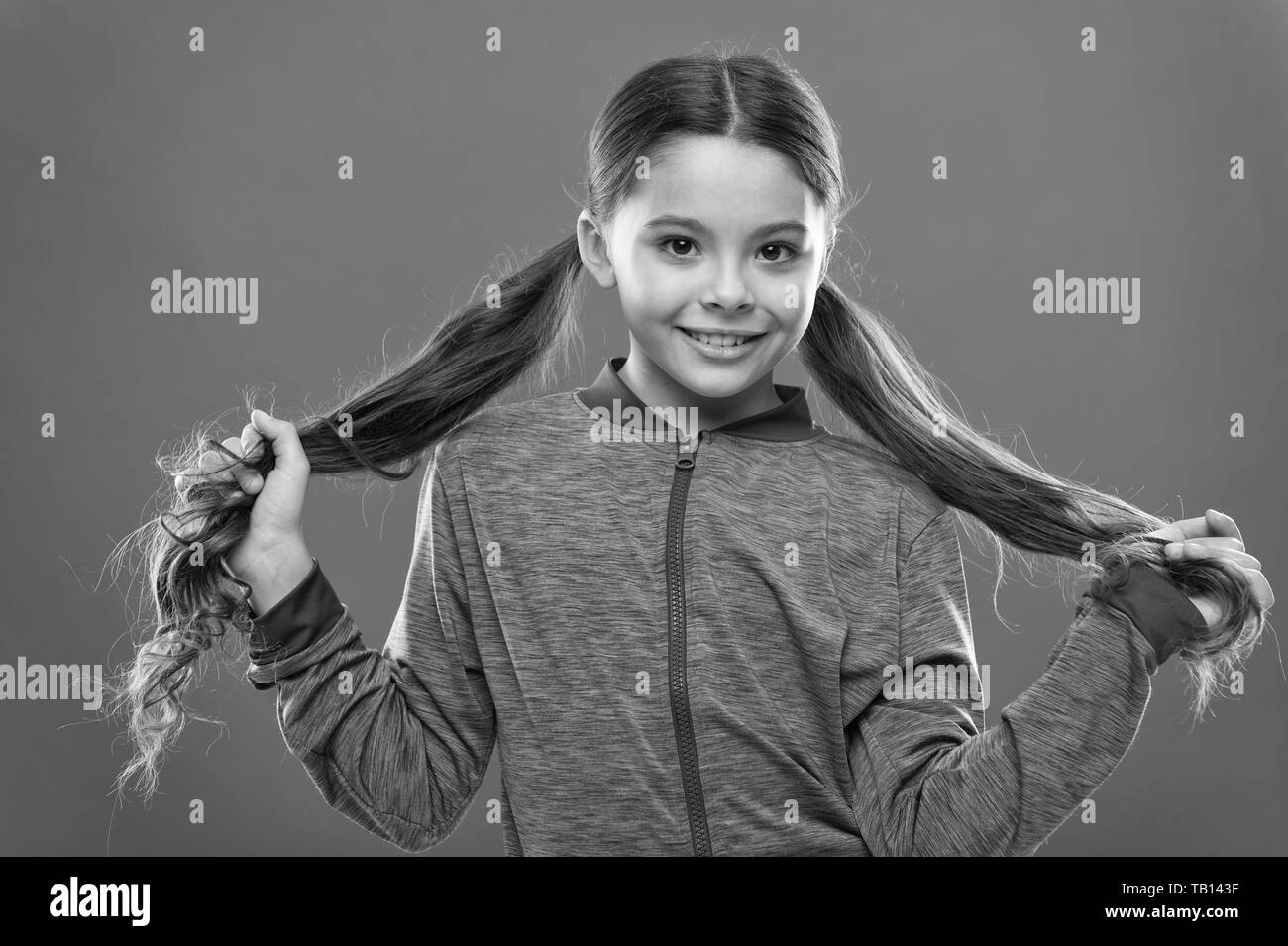 childrens day. Portrait of happy little child. Happy little girl with long hair. Kid fashion and ...