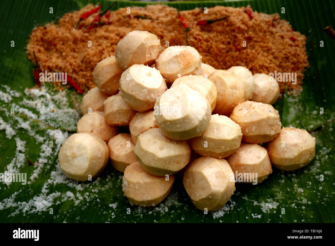 Peeled Santol or Cotton fruit with salt and chili sold at a sidewalk ...