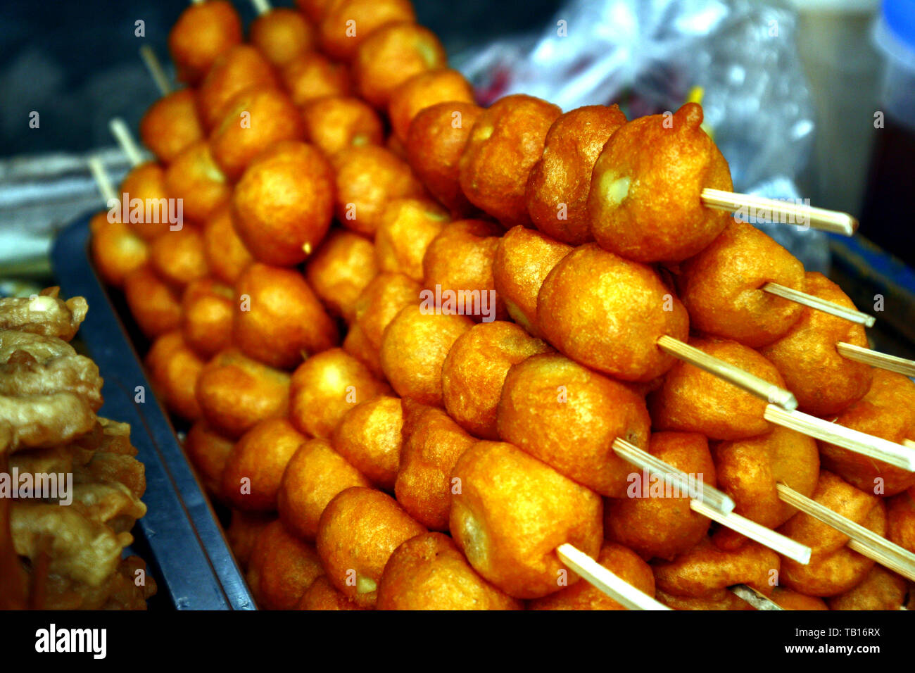 Photo of Kwek kwek or Deep fried quail eggs on a stick Stock Photo - Alamy