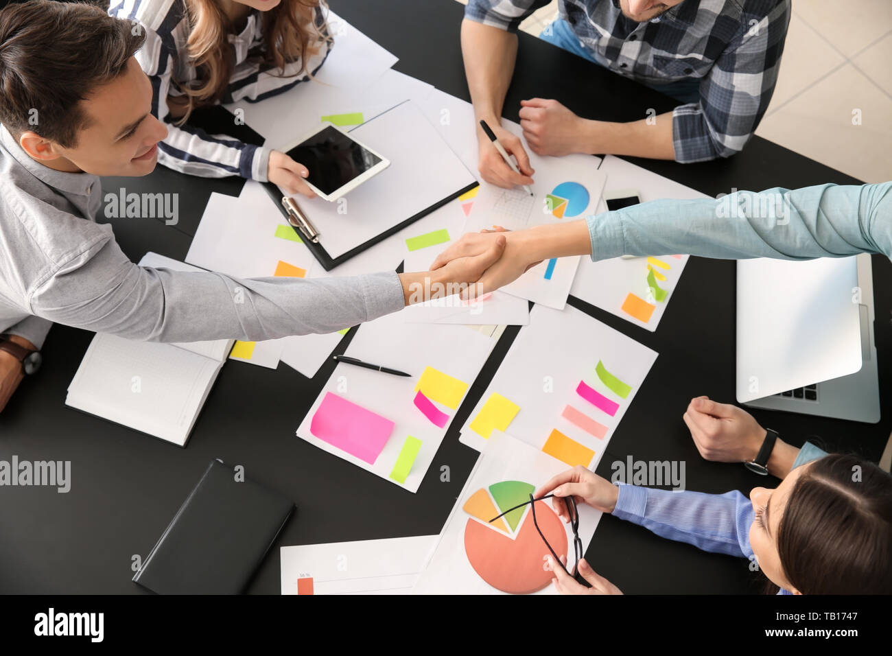 Group of people discussing business plan in office Stock Photo - Alamy