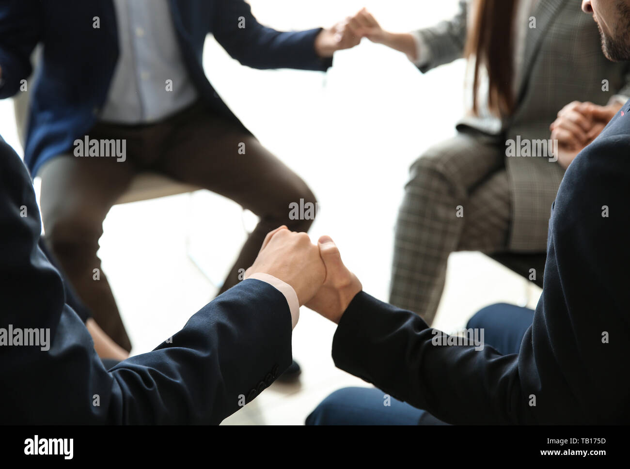 Group of people praying before meeting in office Stock Photo - Alamy