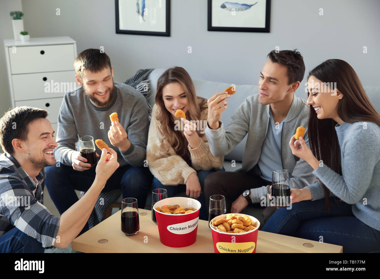 Man eating chicken nuggets hi-res stock photography and images - Alamy